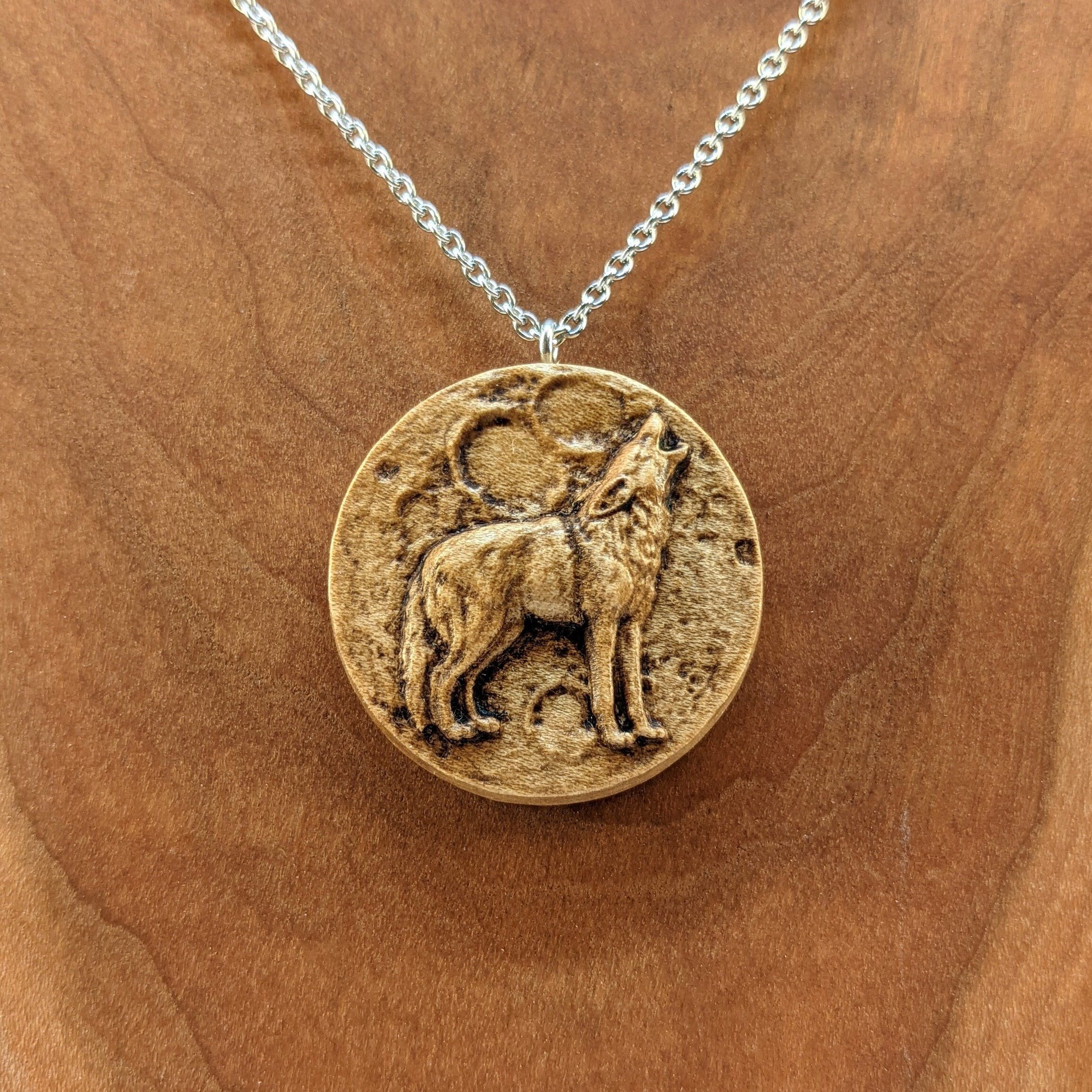 Wolf Howling at the Moon Carved Pendant – Davidson Workshop